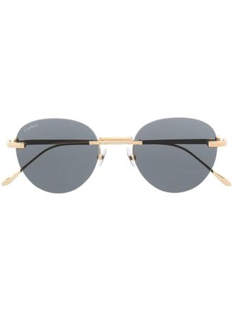 Cartier lunettes de soleil CT0331S &agrave; monture ronde - Or