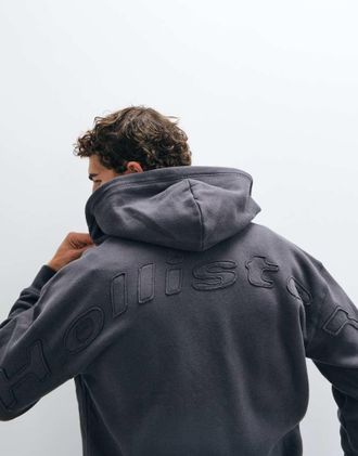 Hollister sweat &agrave; capuche zipp&eacute; avec logo graphique au dos en noir d&eacute;lav&eacute;