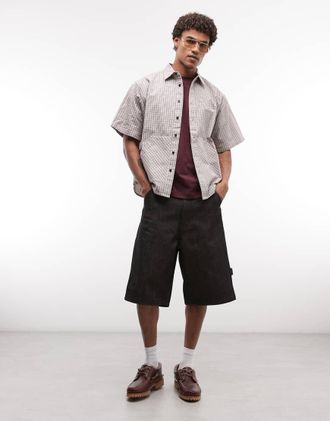 XLARGE Bermuda en jean coupe baggy oversize avec d&eacute;coupe et broderie sur la poche arri&egrave;re - Noir
