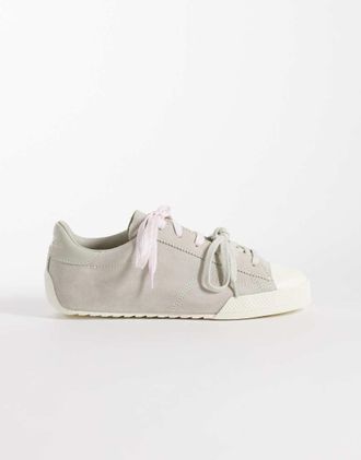Converse Chuck Taylor Lo - Sneaker in Gr&uuml;n mit zwei Paar Schn&uuml;rsenkel-Rosa