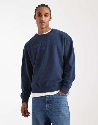 Levi's Sweat ras de cou coupe carr&eacute;e &agrave; logo brod&eacute; - Bleu marine