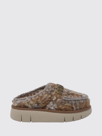 Mou Mules Bounce en shearling avec coutures apparentes et logo en m&eacute;tal