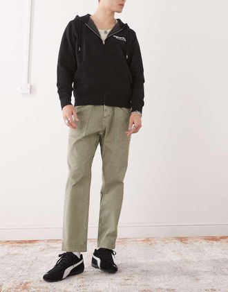 Gramicci Pantalon fuselé ample à surpiqûres - Vert