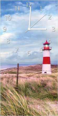 Wallario Design-Wanduhr, Acrylglasuhr Größe 30 x 60 cm, weiße Zeiger, Motiv Leuchtturm am Strand von Sylt