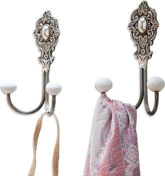 Loberon Haken 2er Set Millar, wunderschöne Ornamente, edel & elegant, authentische Antik-Finish, Garderobe, Organisation, Messing, Keramik, antiksilber