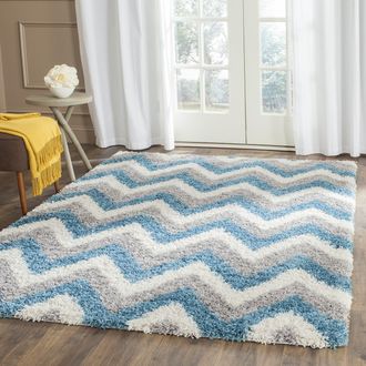 Safavieh Zottelig Teppich für Wohnzimmer, Esszimmer, Schlafzimmer - Kids Shag Collection, Hoher Flor, Elfenbein und Blau, 160 X 229 cm