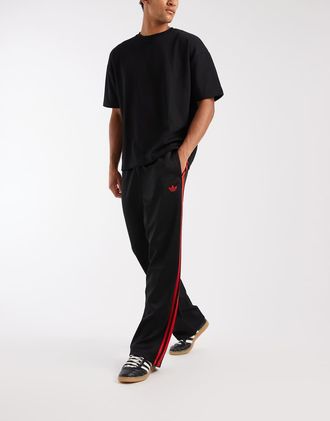 adidas Originals Adicolor - Pantalon de jogging ample - Noir/rouge vif