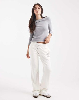 Superdry Athletic - Pantalon de jogging &eacute;vas&eacute; &agrave; imprim&eacute; - Os/blanc cass&eacute;