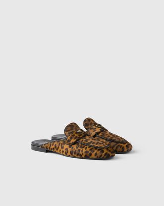 Prada Mules aus Leder mit Leoparden-Print