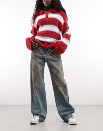 Icecream Jeans aus Baggy-Denim mit Running-Dog-Applikation in Dirty-Wash-Blau