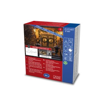 Konstsmide LED Premium System Basis-Set, Lichterkette und Transformator, 100 bernsteinfarbene Dioden, 31V, Außen (IP67), 20W, schwarzes Soft-Kabel - 4912-817