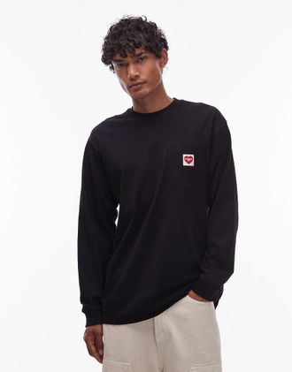 Carhartt Work in Progress T-shirt ample &agrave; manches longues &agrave; imprim&eacute; coeur sur la poche - Noir