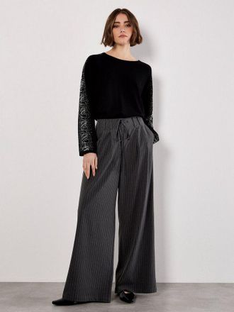 Apricot Strickpullover Fledermauspullver. mit Verzierung im Schlangenmuster