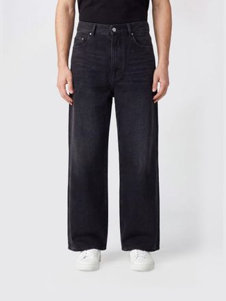 Amiri Jean large en denim de coton avec design &agrave; cinq poches et braguette &agrave; boutons