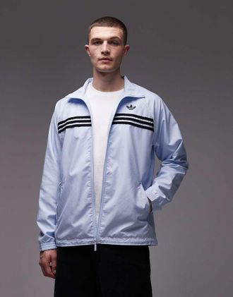 adidas Originals Haut de surv&ecirc;tement &agrave; bandes sur le devant - Bleu clair