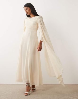 Beauut Robe longue ornement&eacute;e &agrave; manches effet cape - Blanc cass&eacute;