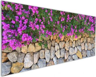 Wallario K&uuml;chenr&uuml;ckwand aus Glas 125 x 50 cm, Motiv: Mauer mit pinken Bl&uuml;ten | Spritzschutz abwischbar & pflegeleicht