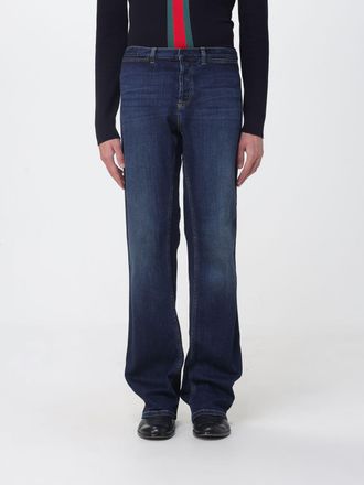 Gucci Jean coupe slim en denim de coton avec d&eacute;tail Web