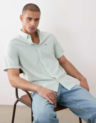 GANT Chemise ray&eacute;e coupe classique en cr&eacute;pon - Aigue-marine-Bleu