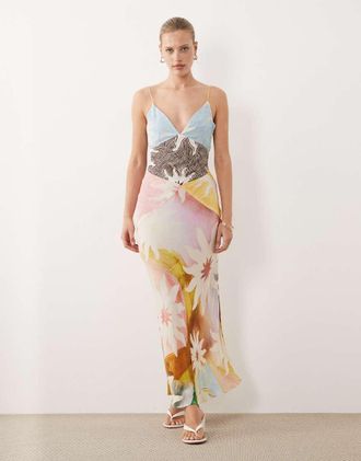 Never Fully Dressed Valeria - Robe longue &agrave; bretelles fines en satin &agrave; imprim&eacute; soleil - Pastel-multicolore