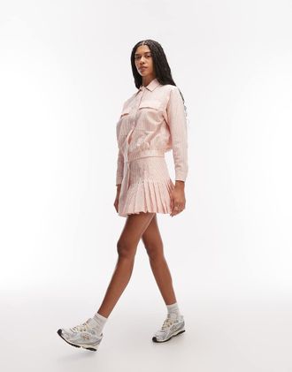 Lacoste Tennisrock in Orange und Wei&szlig; gestreift, Kombiteil