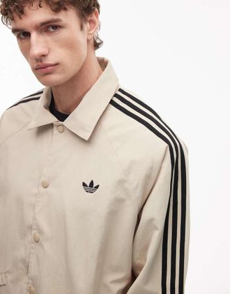 adidas Originals Veste dentra&icirc;neur &agrave; logo 3 bandes - Taupe-Neutre