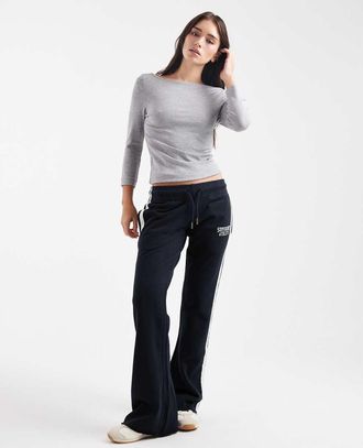 Superdry Athletic - Gestreifte, ausgestellte Jogginghose in Eclipse Navy-Marineblau