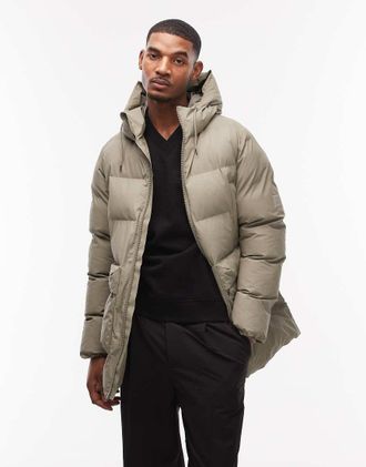 Rains 15210 Alta - Lange, wasserdichte Cargo-Steppjacke in Blassgr&uuml;n