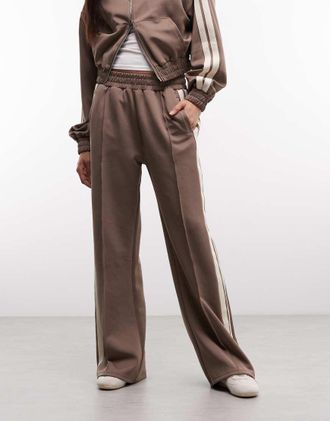 Cernucci pantalon de jogging large avec bandes lat&eacute;rales-Neutral