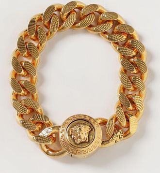 Versace Bracelet en m&eacute;tal dor&eacute; avec d&eacute;tail Medusa en relief