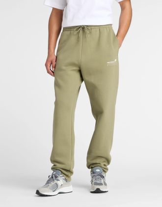 New Balance Linear - Pantalon en polaire à imprimé graphique - Vert