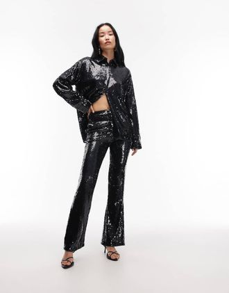 Asos Pantalon ajust&eacute; coupe &eacute;vas&eacute;e orn&eacute; de sequins de qualit&eacute; sup&eacute;rieure - Bleu marine