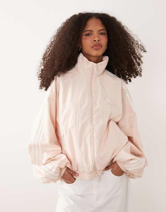 adidas Originals Haut de surv&ecirc;tement en nylon &agrave; manches ballon - Rose clair