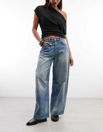 Weekday jean large baggy &agrave; taille basse avec d&eacute;tails us&eacute;s, d&eacute;lavage bleu d&eacute;lav&eacute;