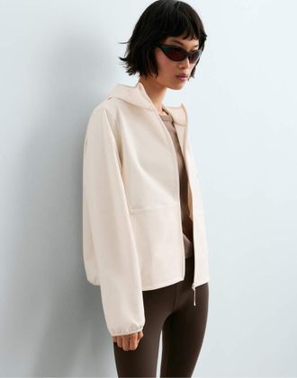 Oysho veste technique stretch en &eacute;cru p&acirc;le-Neutre