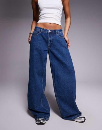Princess Polly Ramos - Jeans in Dunkelblau mit niedrigem Bund und weitem Bein