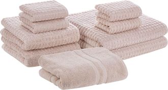 Beliani Frottee Handtuch Set mit Badematte Baumwolle rosa 9-teilig Atai