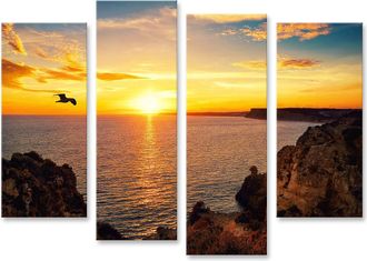 Islandburner Bild auf Leinwand Sonnenuntergang &uuml;ber dem Meer mit fliegender M&ouml;we und Felsk&uuml;ste Bilder Wandbilder 130x80cm