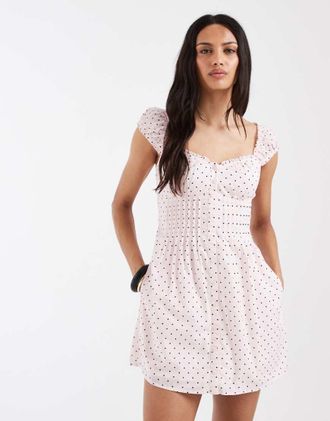 Hollister Robe courte &agrave; pois avec taille smock&eacute;e tendance folk - Rose
