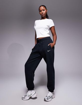 Nike Phoenix Fleece - Pantalon de jogging oversize &agrave; chevilles resserr&eacute;es et taille haute - Noir