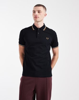 Fred Perry Schwarzes Polohemd mit Logo und zwei Zierstreifen