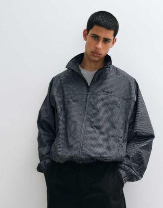 Cernucci Windbreaker-Jacke mit Stehkragen und Karomuster in Schwarz