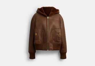 Coach Wendbarer Shearling-Hoodie f&uuml;r Frauen in Braun, Gr&ouml;&szlig;e X-Klein | Wolle