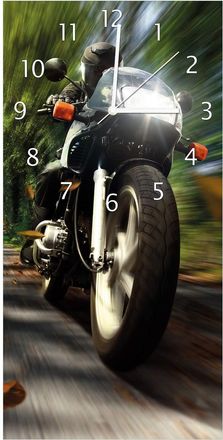 Wallario Design-Wanduhr Fahrendes Motorrad im Wald mit Herbstlaub aus Glas, Motiv-Uhr Größe 30 x 60 cm, weiße Zeiger
