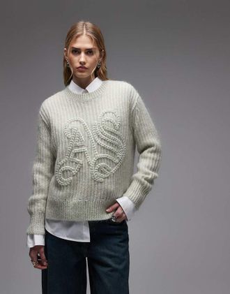 AllSaints Pull ras de cou &agrave; embl&egrave;me brod&eacute; - Vert p&acirc;le