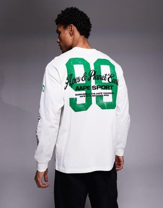 Aape By A Bathing Ape AAPE by A BATHING APE - Lang&auml;rmliges T-Shirt in Wollwei&szlig; mit mehreren Placement-Prints-Bunt