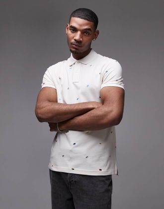 Tommy Hilfiger Polo avec imprimé drapeau sur lensemble - Blanc cassé