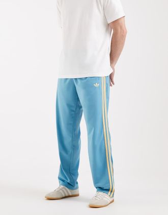 adidas Originals Firebird - Pantalon de surv&ecirc;tement - Bleu d&eacute;lav&eacute; et orange