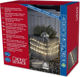 Konstsmide LED Lichterschlauch, 18m, mit Lichtsensor und 6h und 9h Timer, 288 warm wei&szlig;e Dioden, batteriebetrieben, Au&szlig;en (IP44), 4 x D 1.5V (exkl.) - 3746-100