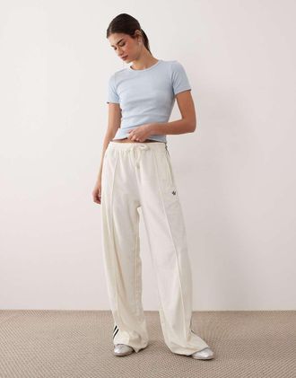 adidas Originals Firebird - Pantalon en tissu &eacute;ponge - Blanc cass&eacute;